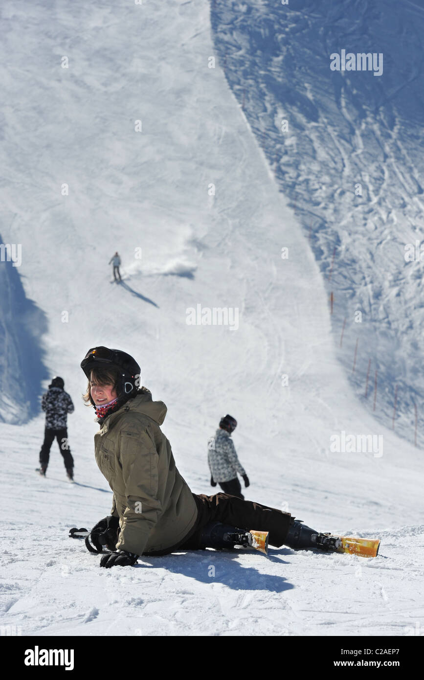 A boy rests after a skiing fall at the Vogel Ski Centre on the the Sija ...