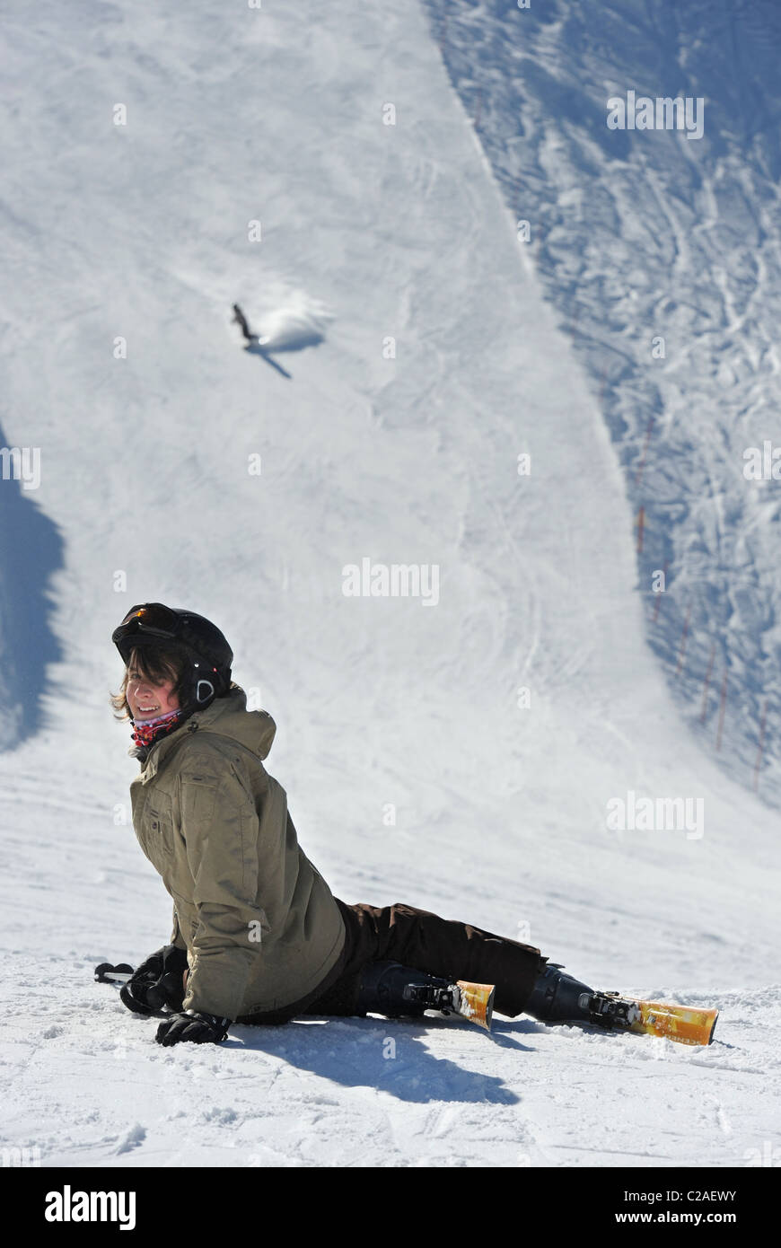 A boy rests after a skiing fall at the Vogel Ski Centre on the the Sija ...