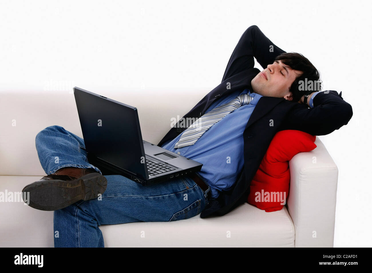 Businessman taking lying on back and thinking while resting on sofa and ...