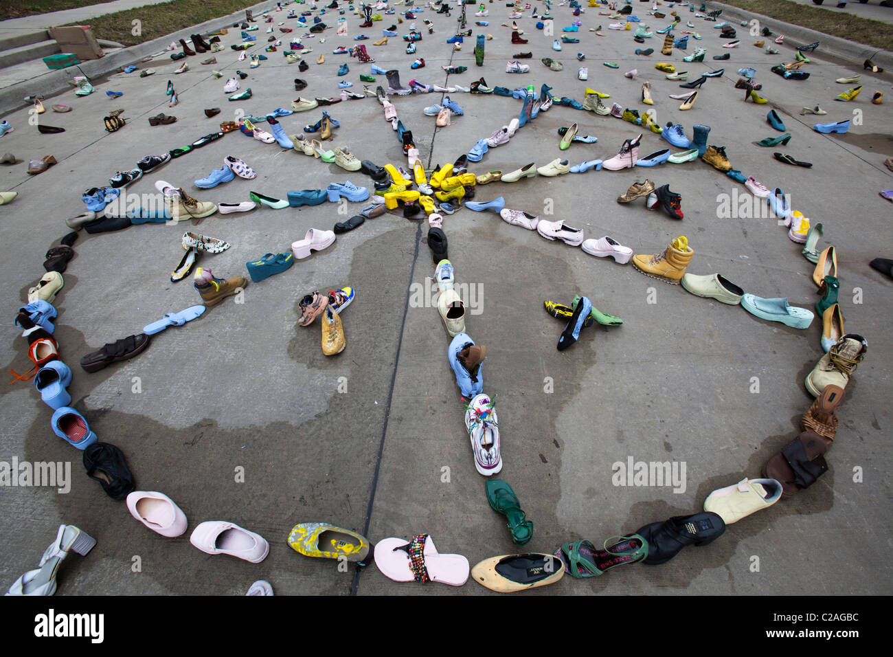 Art exhibit of thousands of shoes on the street represents the issue of ...