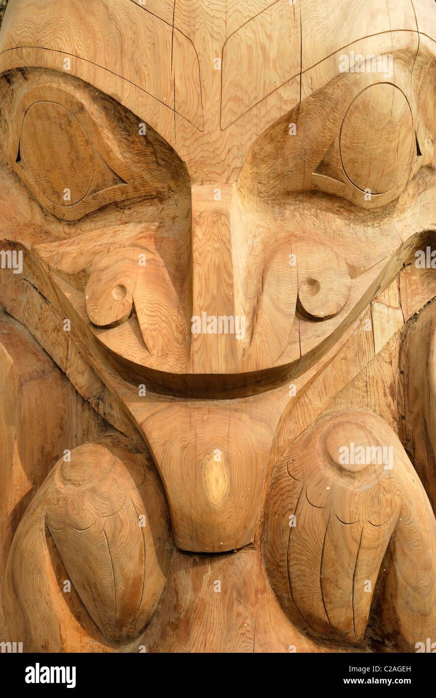 Close-up of a character carved into wood creating a totem pole Stock ...
