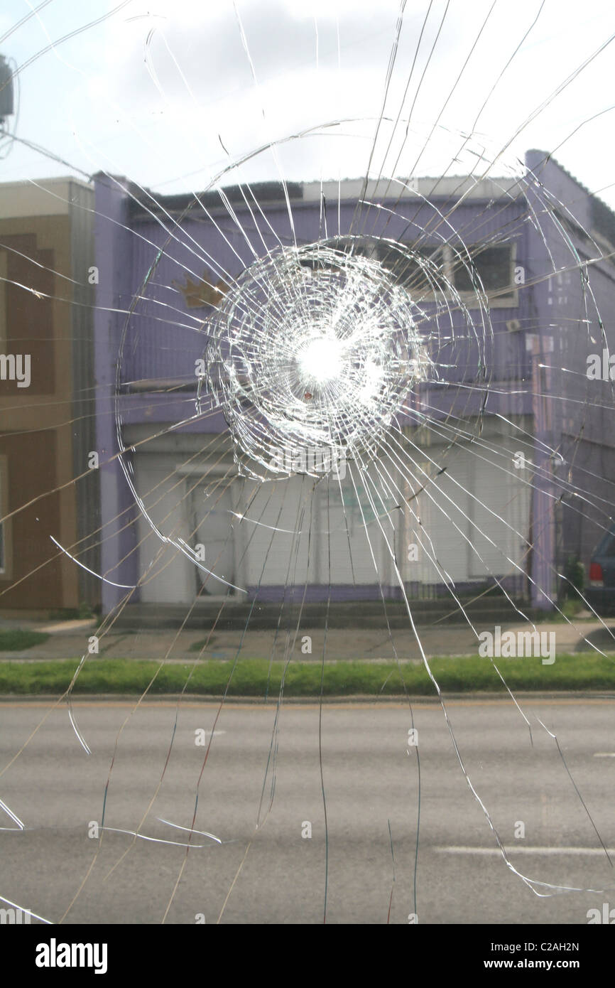 Hurricane Katrina damaged commercial building abandoned cracked window ...