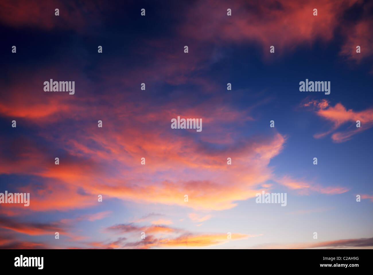 Dark red sunset clouds and deep blue sky Stock Photo - Alamy
