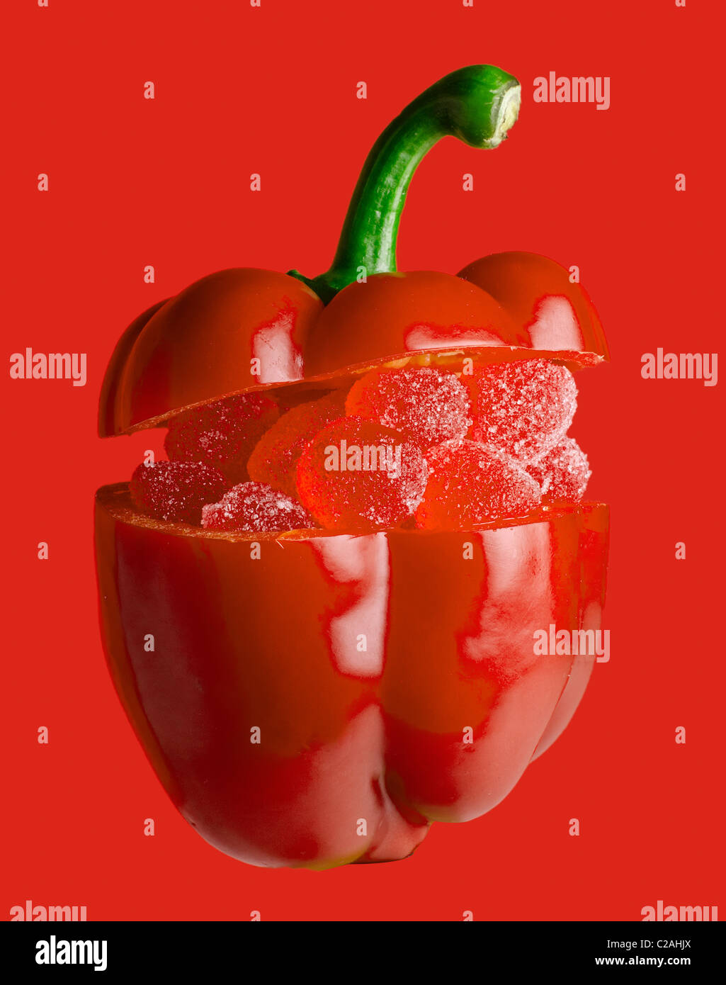 a pepper fruit filled with red jelly candy Stock Photo - Alamy