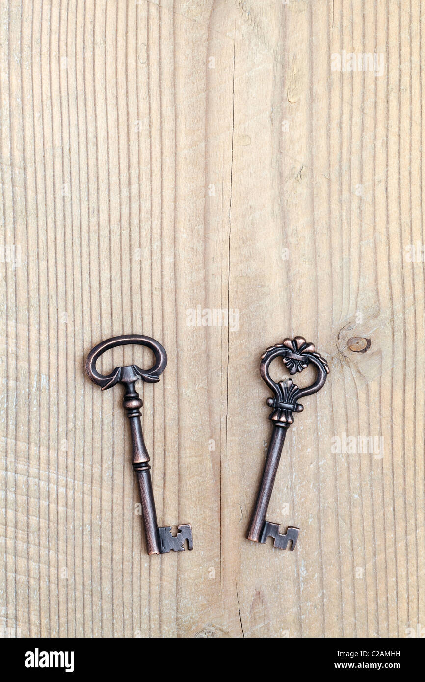 Old keys on wooden table Stock Photo - Alamy