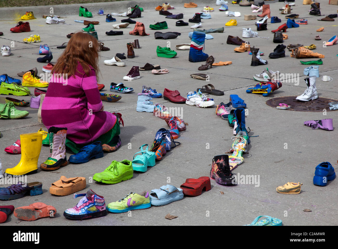 Art exhibit of thousands of shoes on the street represents the issue of ...