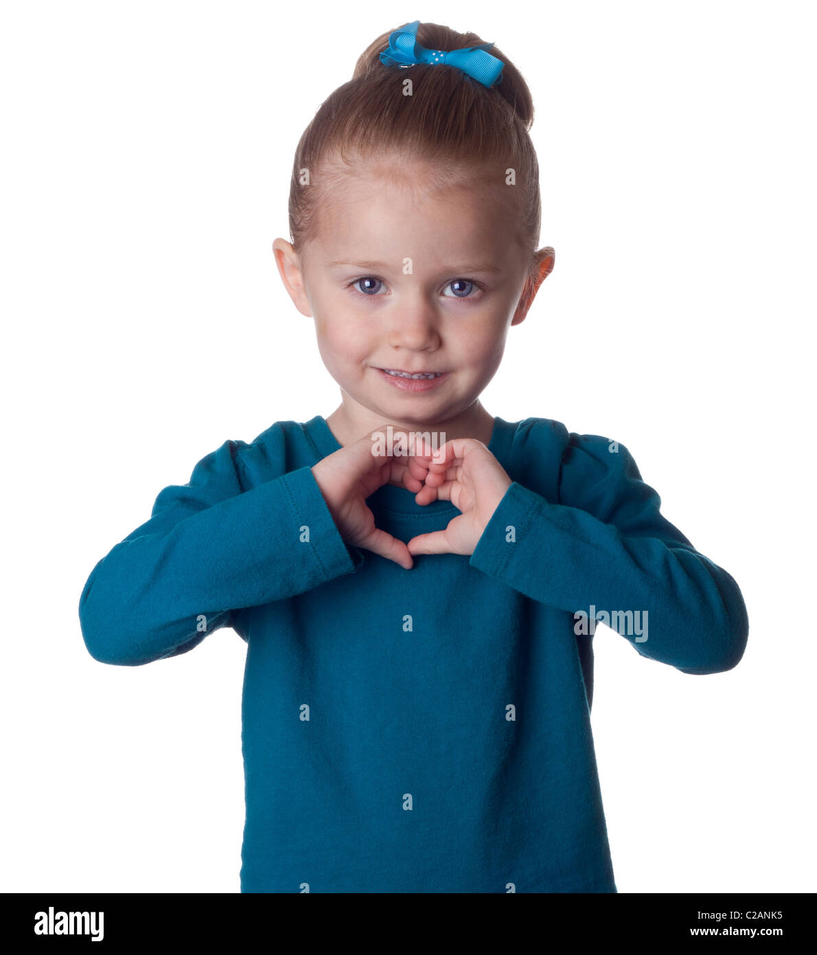A cute young child forms the shape of a heart in her hands Stock Photo ...