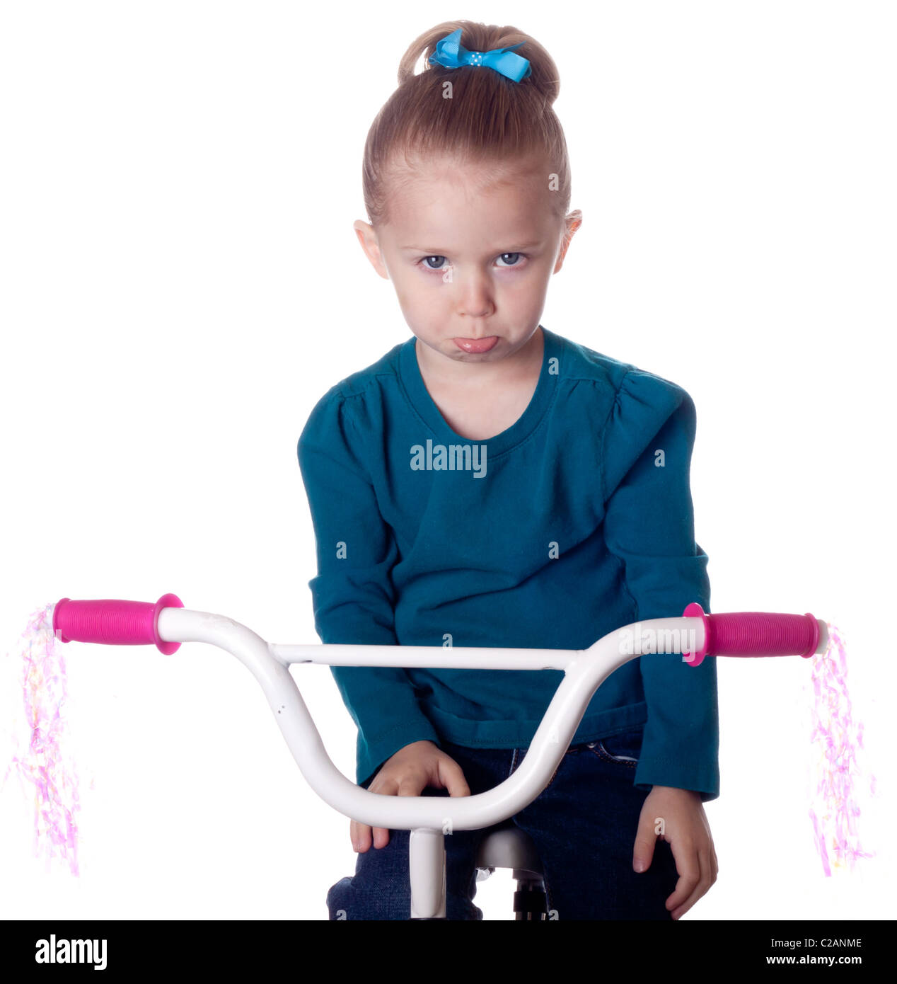 A girl is sad because she has to stop riding her bike Stock Photo - Alamy