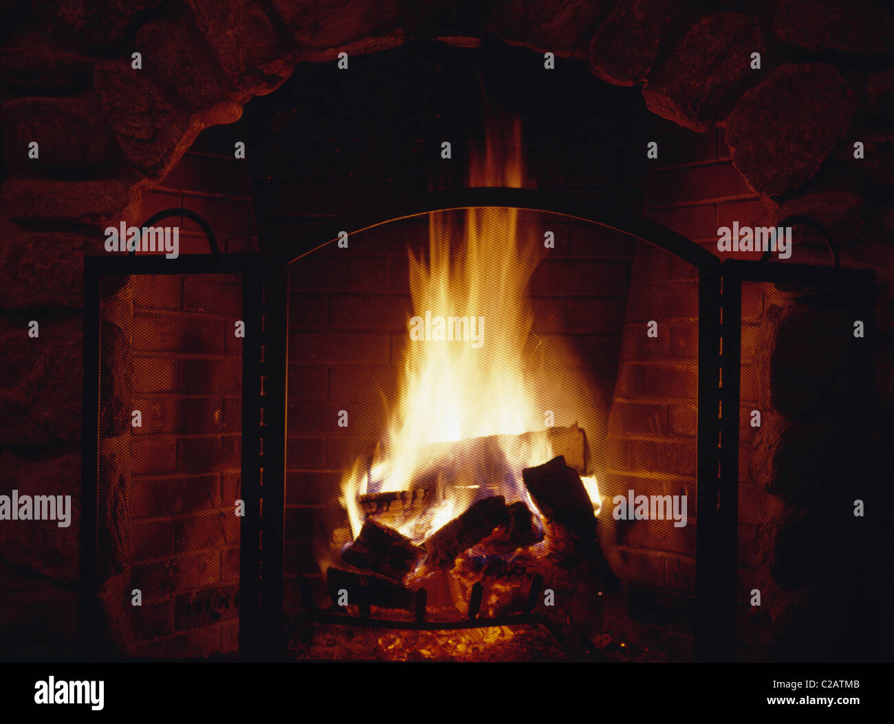 Fire burning in fireplace Stock Photo - Alamy