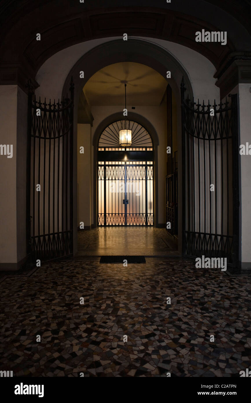 Closed door in the end of corridor Stock Photo - Alamy