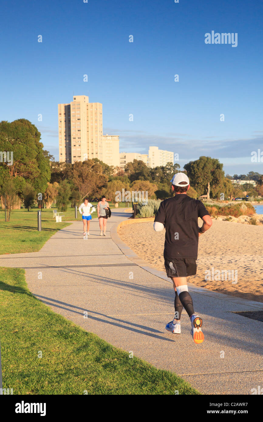 Man jogging down a path in the early morning Stock Photo - Alamy