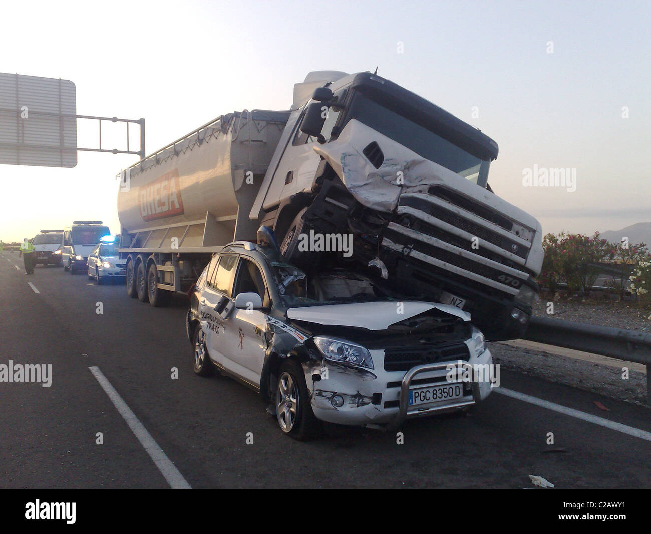 TRACTOR TRUCK V COP CAR A Toyota police car and its driver came out ...
