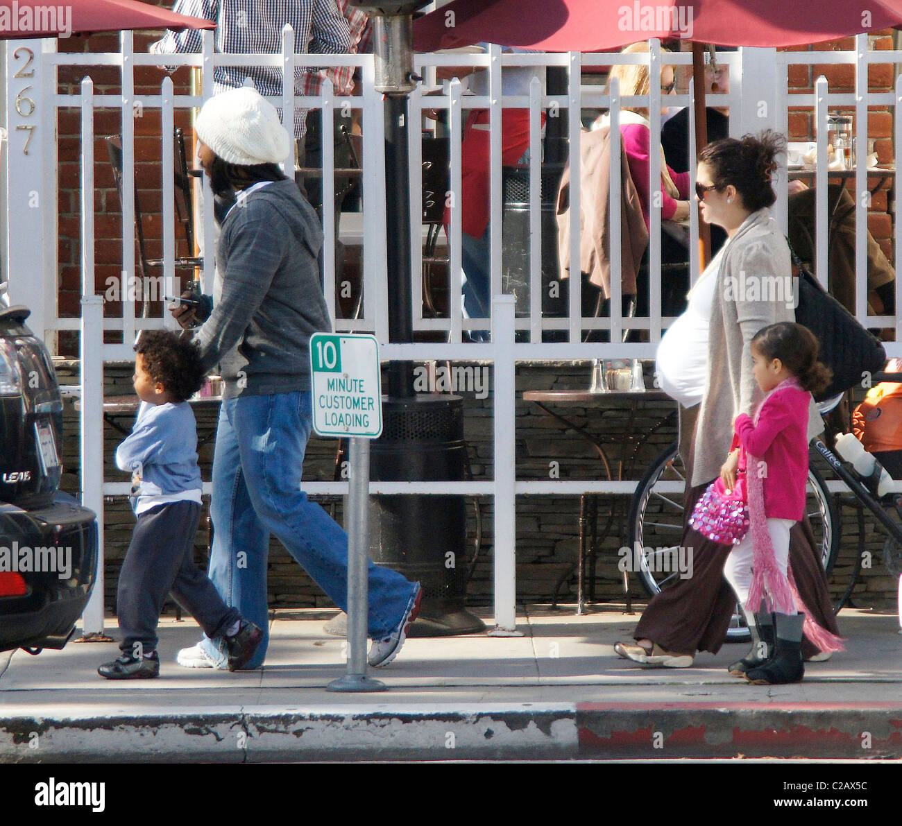 Ziggy Marley, his heavily pregnant wife Orly Agai, son Gideon and ...