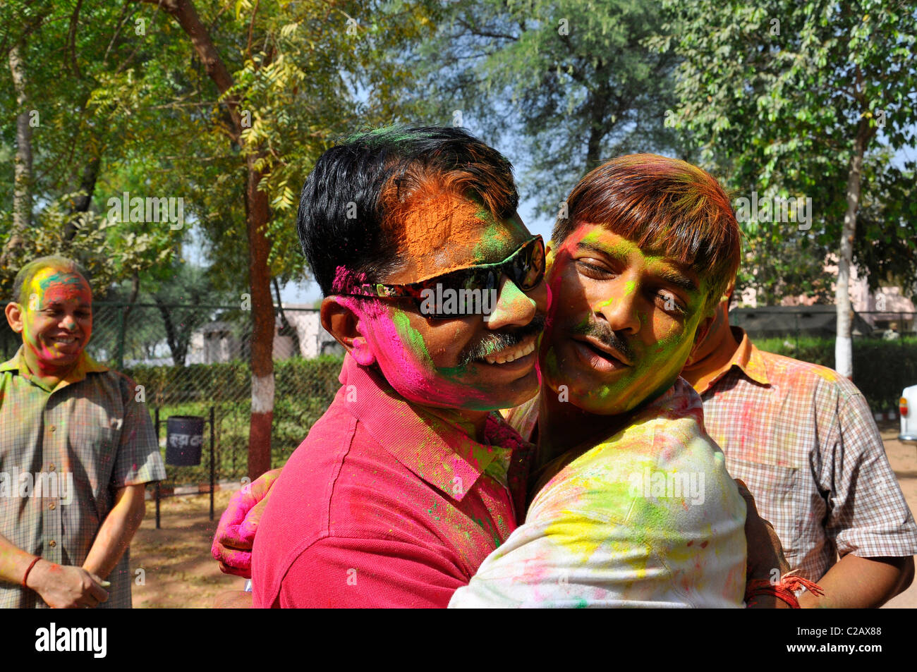 Holi celeberation in India- Two Indians hugging each other Stock Photo ...