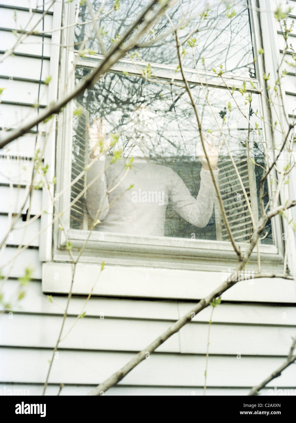 Person looking out window Stock Photo - Alamy