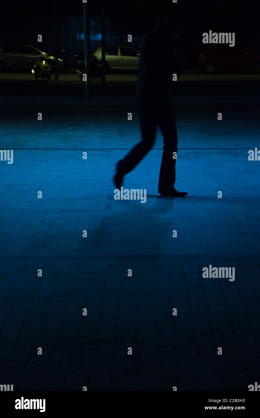 Man walking outside at night Stock Photo - Alamy