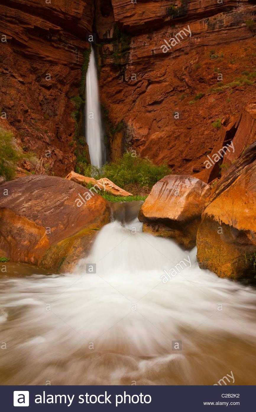 Waterfall from a narrow crevass in a sandstone cliff Stock Photo - Alamy