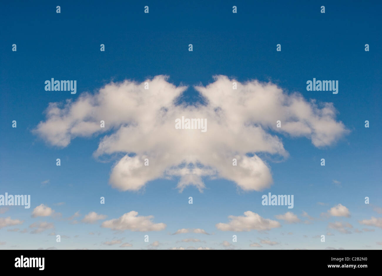 symmetrical clouds formation background on blue sky Stock Photo - Alamy