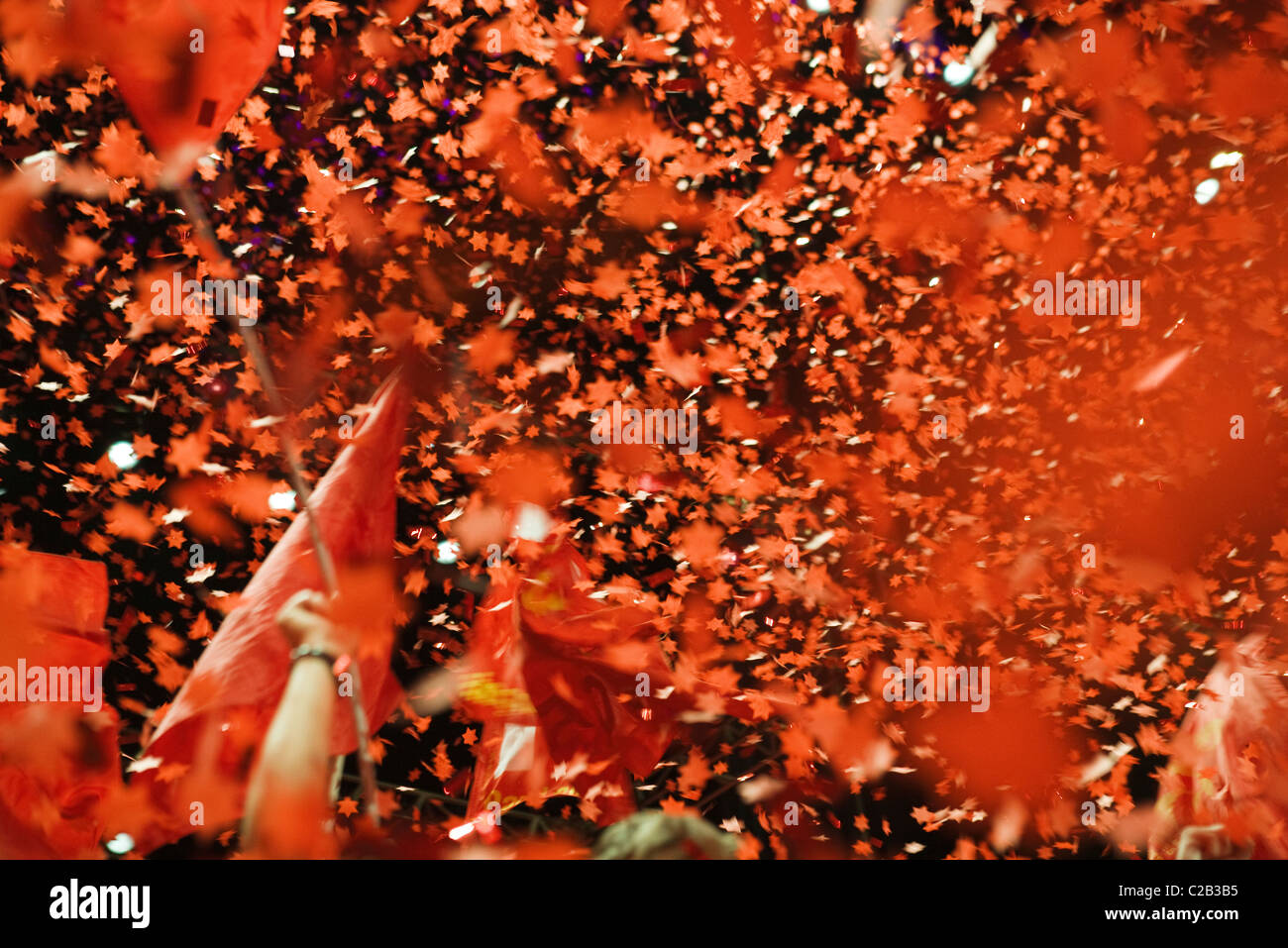 Crowd cheering, flags and confetti in air Stock Photo - Alamy