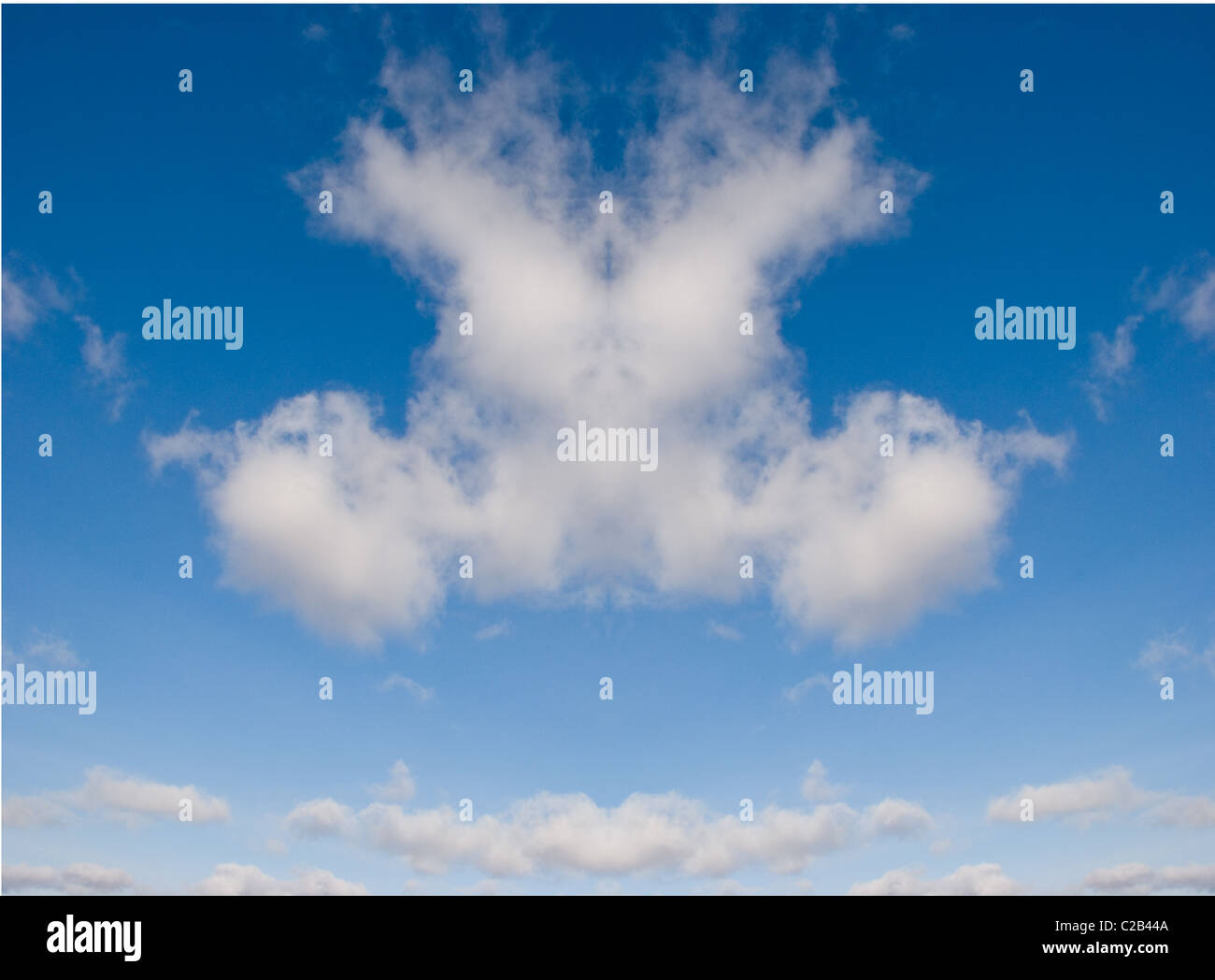 symmetrical clouds formation background on blue sky Stock Photo - Alamy