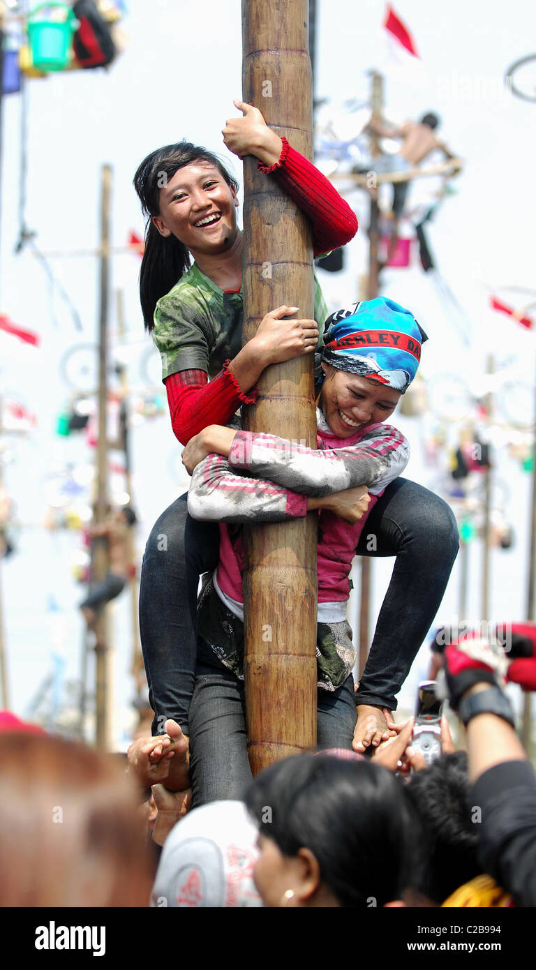 Greasy pole climb hi-res stock photography and images - Alamy