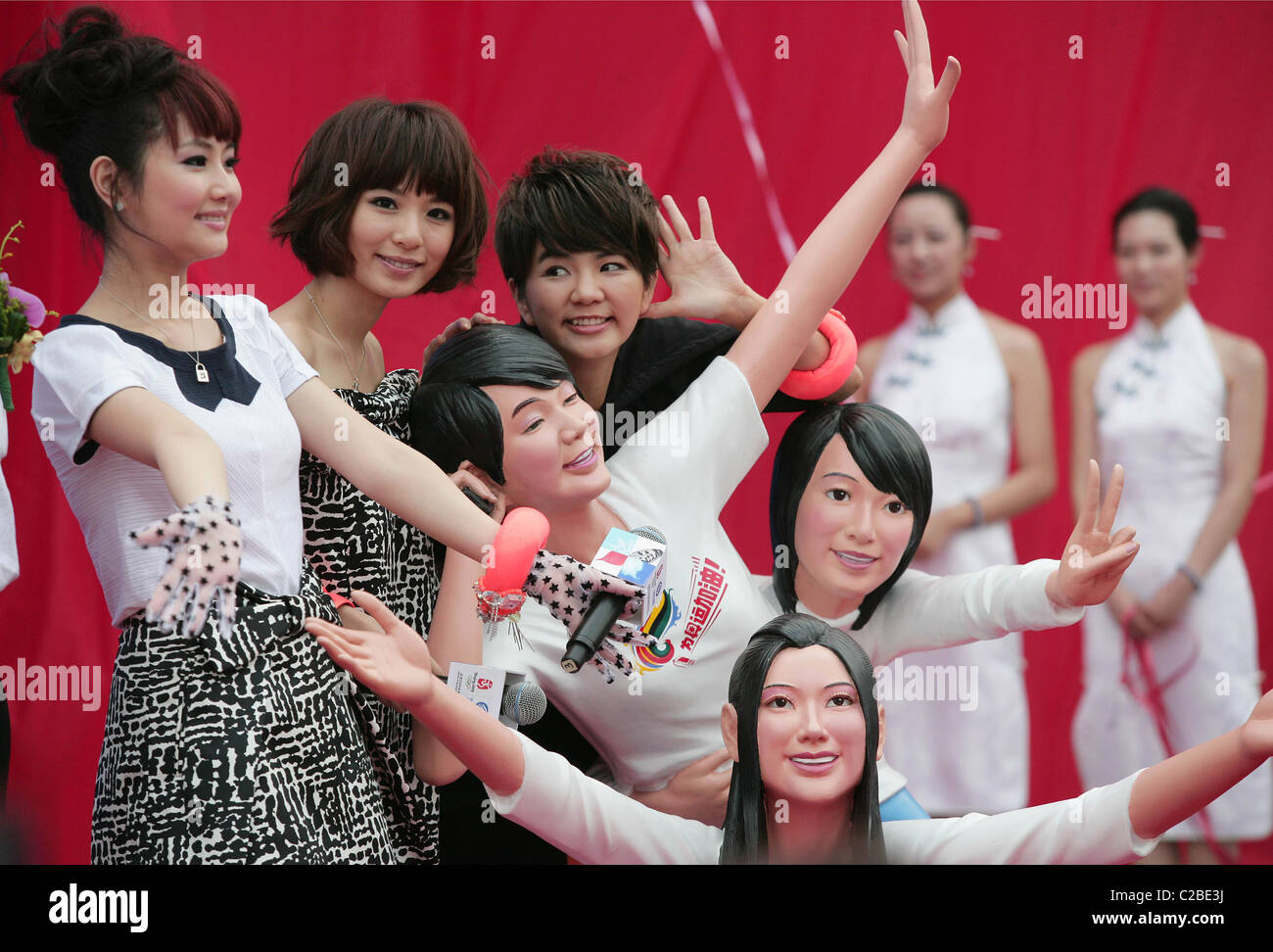 S.H.E pose with sculptures of themselves at the Olympic Sports Centre ...