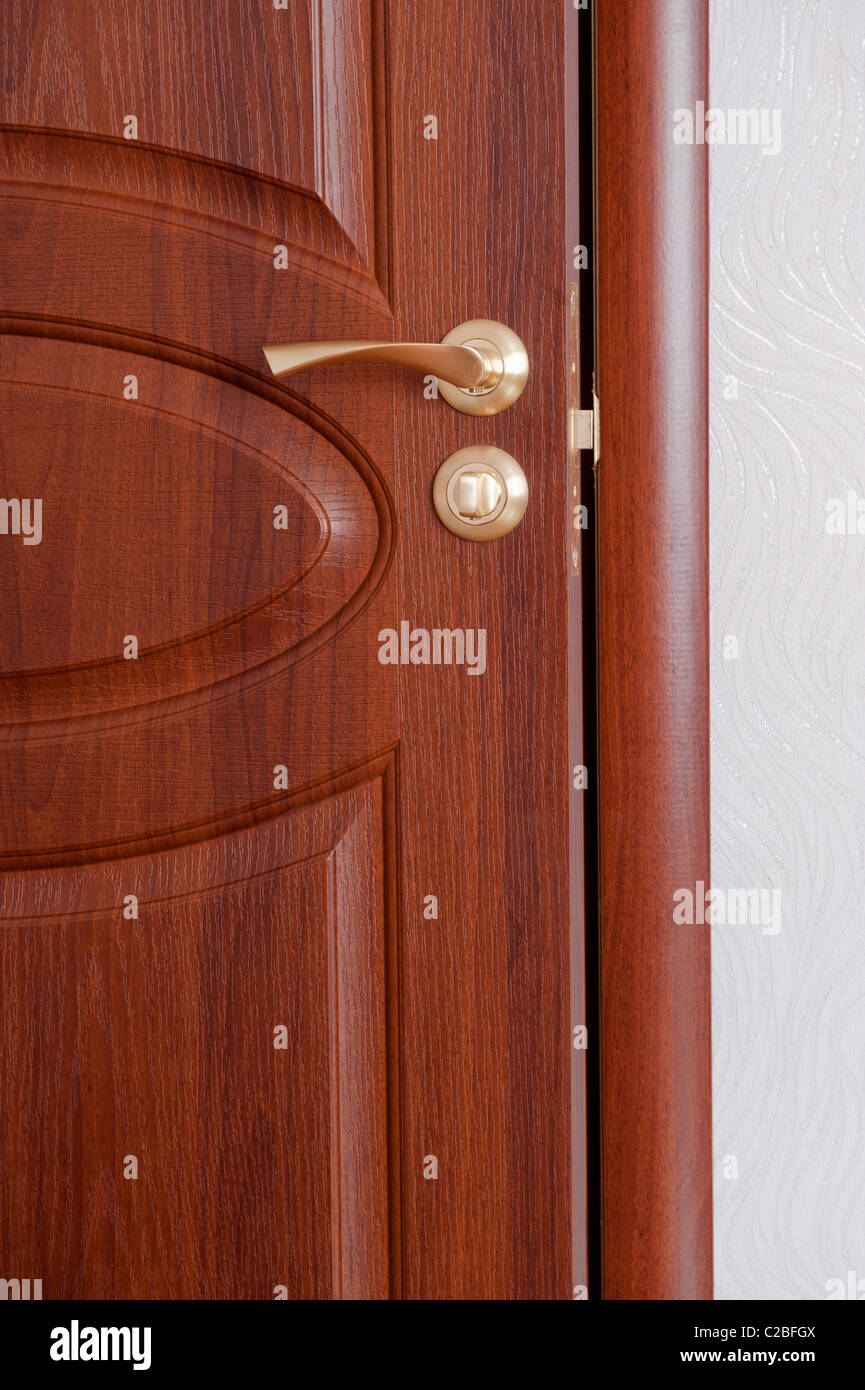 The door handle. A wooden door, brass handles Stock Photo - Alamy