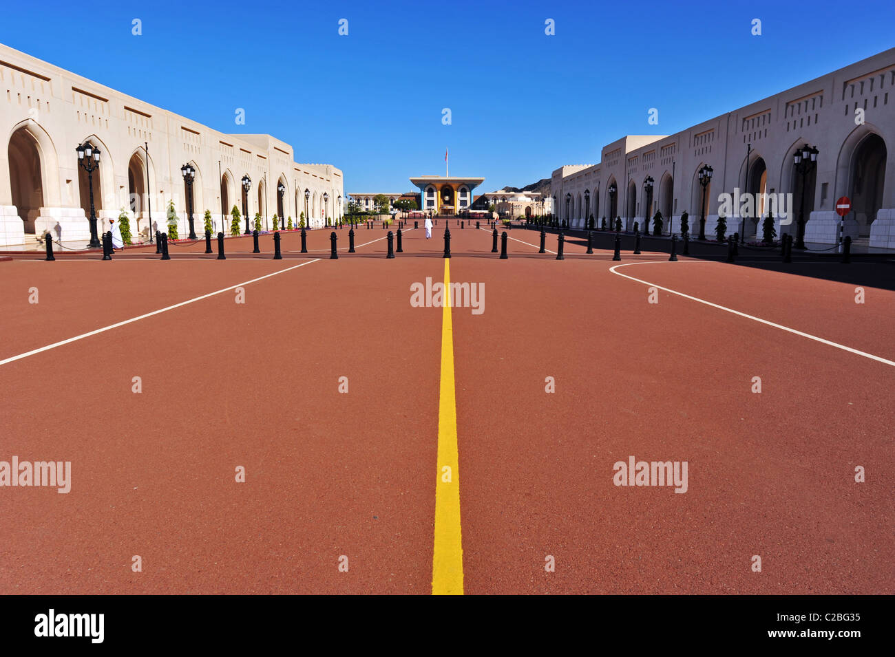 Oman, Muscat, building exterior with poles arranged in a row on the ...