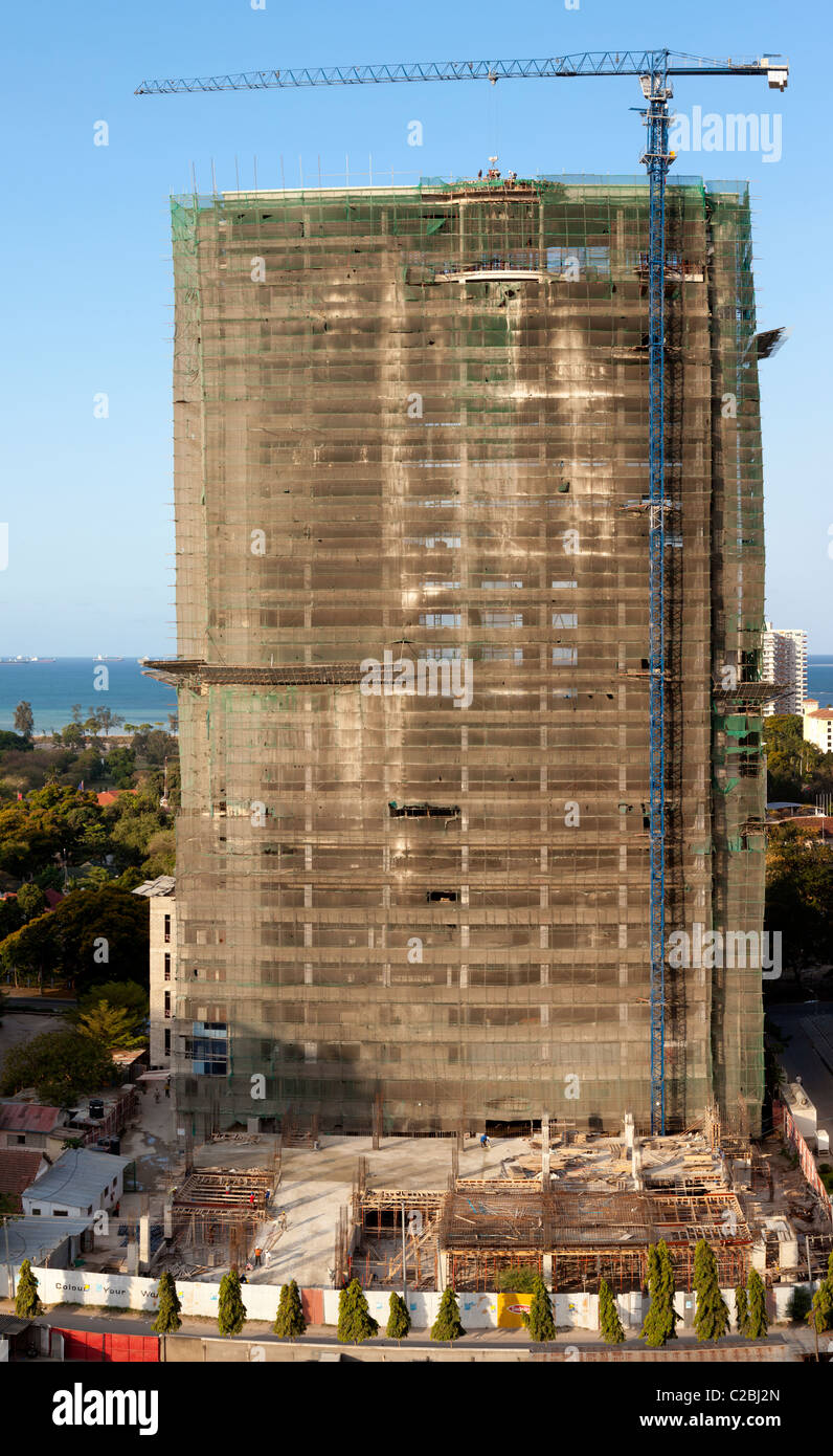 Vertical panorama of a skyscraper under construction. Dar es Salaam ...