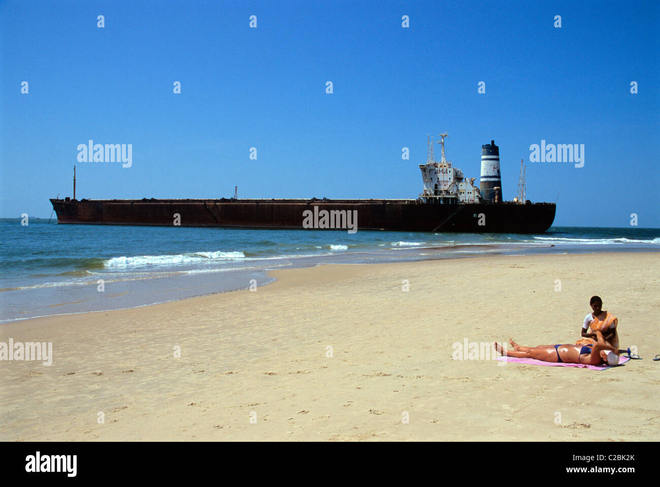 beach massage stranded oil tanker Candolim Goa India Stock Photo - Alamy