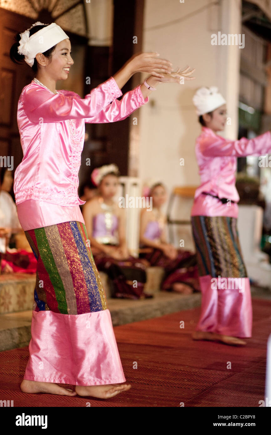 High school girl dancing traditional style at the Kong Ta market street ...