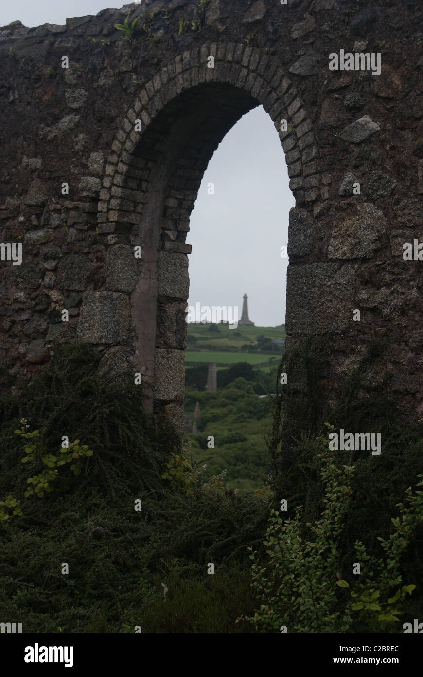 Archway with monument on horizon Stock Photo - Alamy