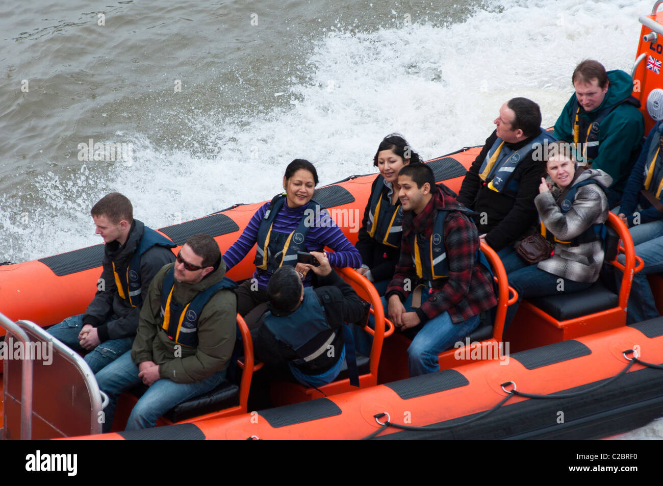 Tourists enjoy adventure ride in speed boat on Thames River London ...