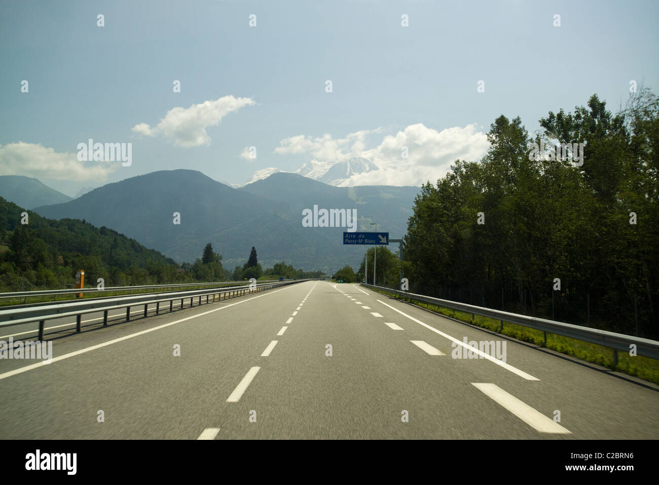 EMPTY MOTORWAY WITH MOUNTAINS IN THE BACKGROUND Stock Photo - Alamy