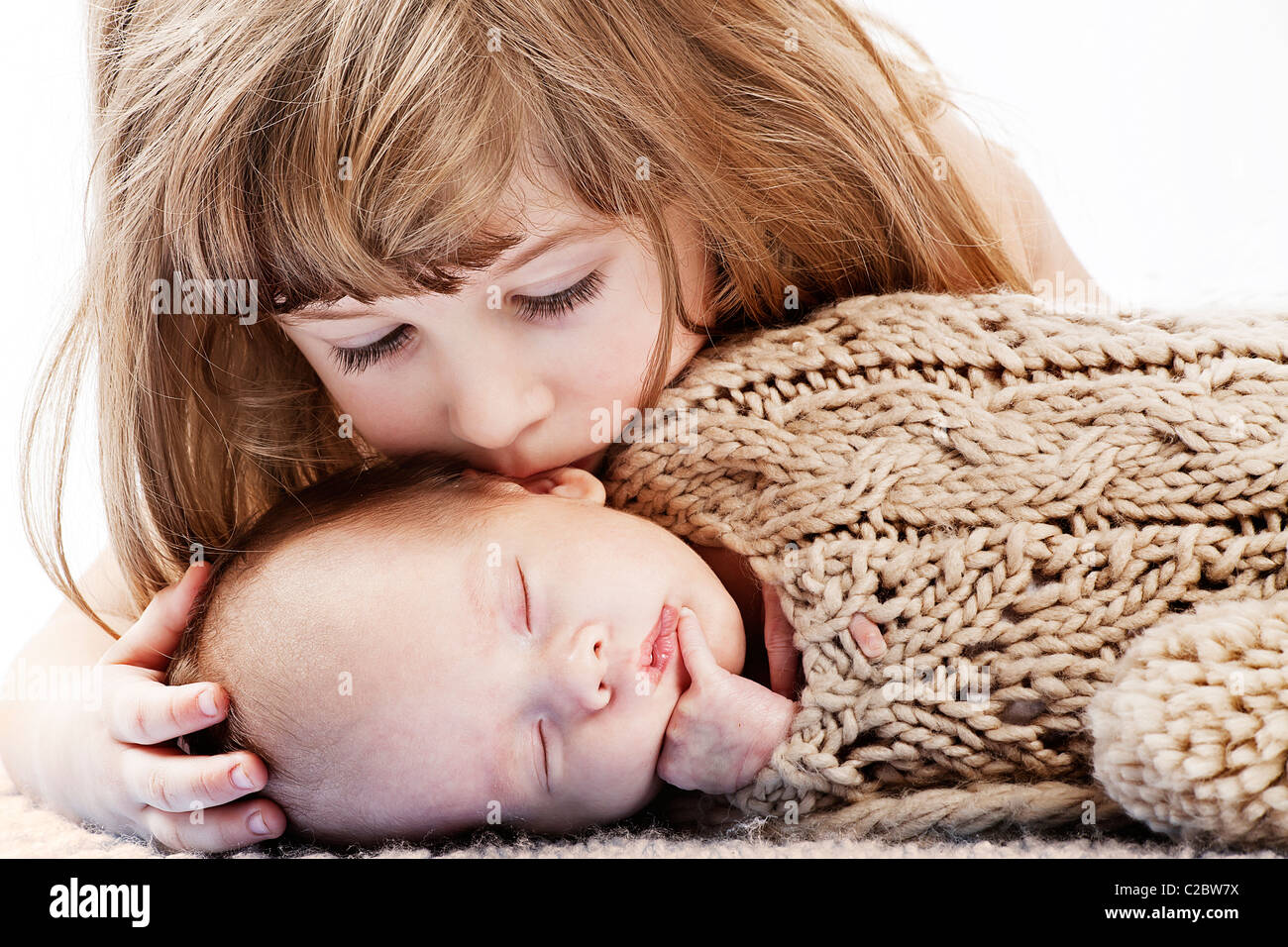 girl kisses her little baby brother Stock Photo - Alamy