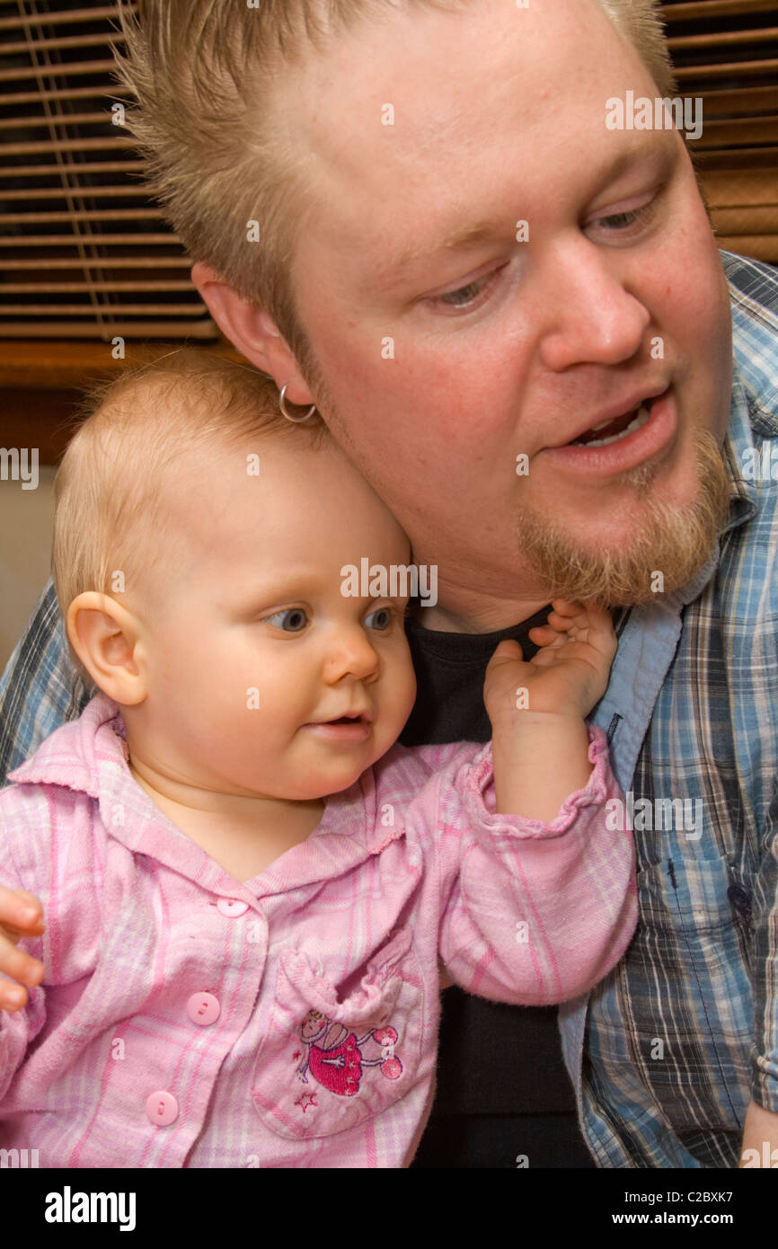 Father age 33 and baby daughter bonding at home. St Paul Minnesota MN ...