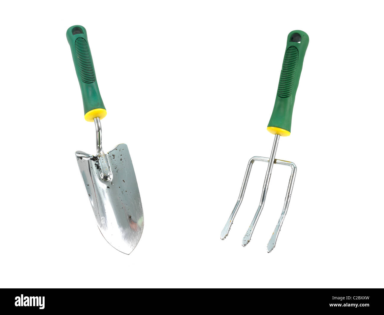 A garden fork and spade isolated against a white background Stock Photo ...