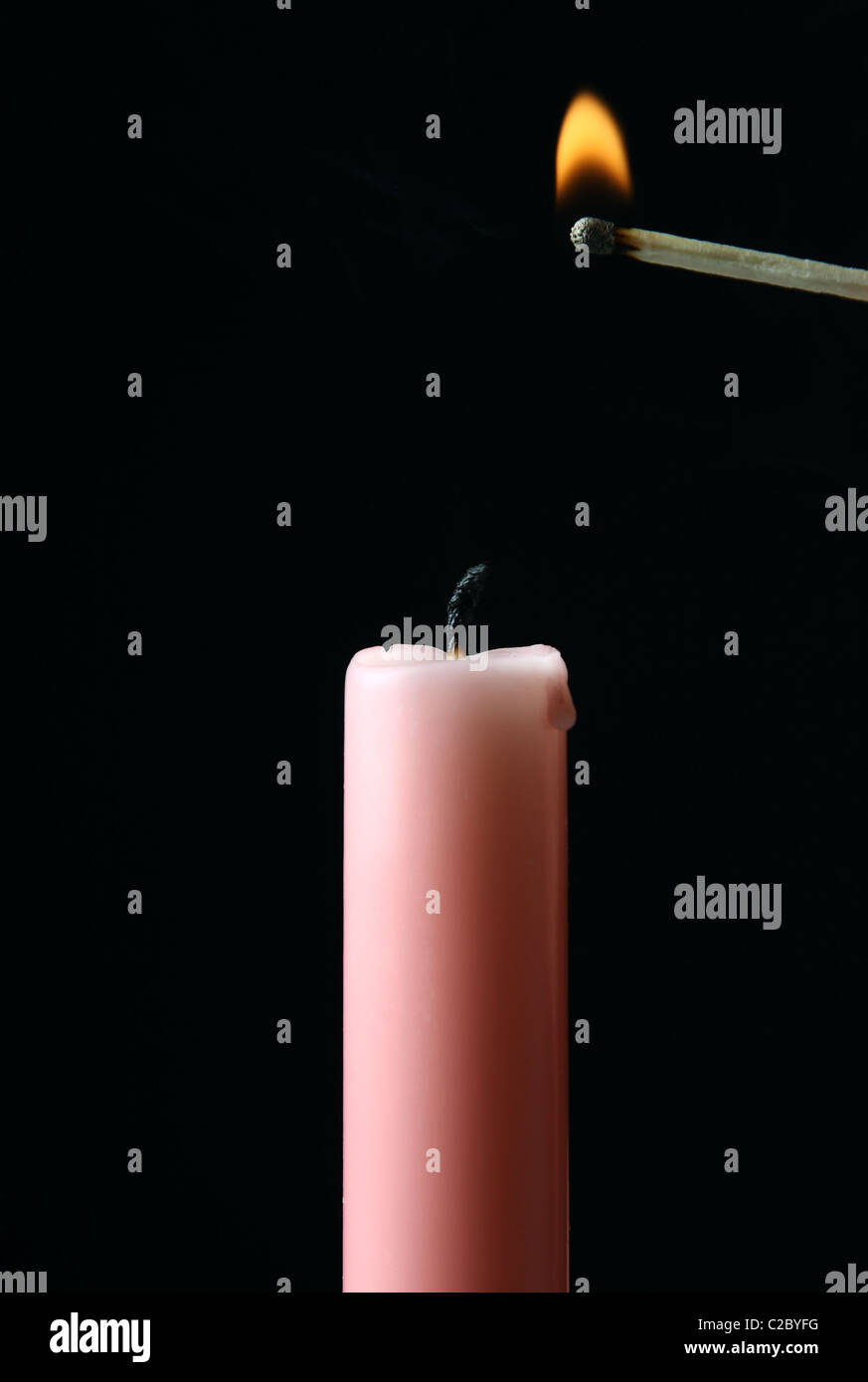 Lighting a candle Stock Photo - Alamy