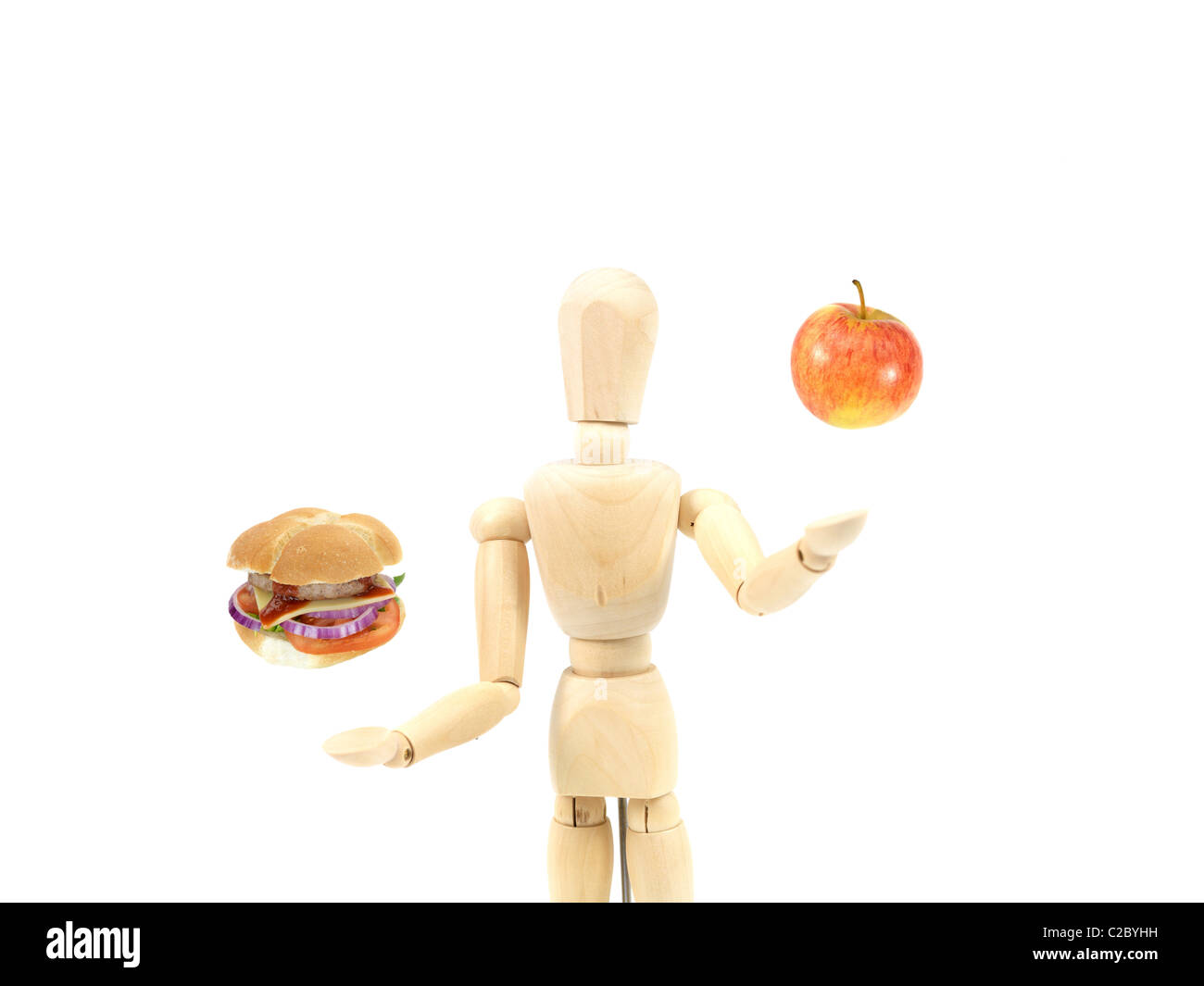 A manikin juggling food on a white background Stock Photo - Alamy