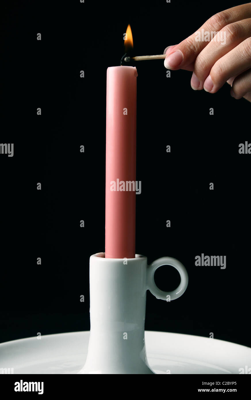 Hand holding candle holder hi-res stock photography and images - Alamy