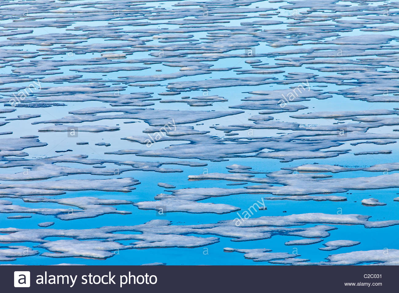 Patterns of ice on blue Arctic waters Stock Photo - Alamy