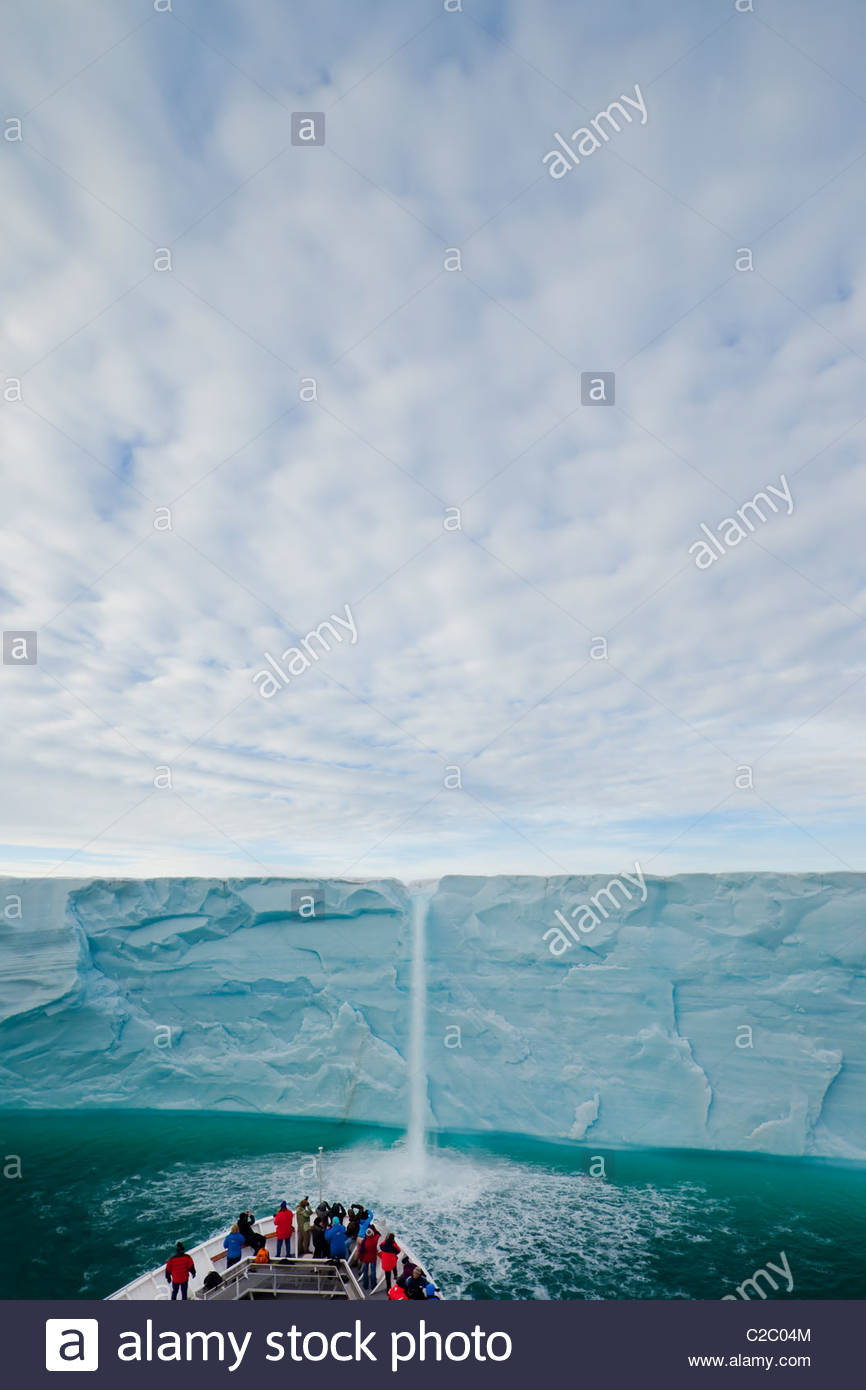 Summer meltwater forms a waterfall on an Arctic icecap Stock Photo - Alamy