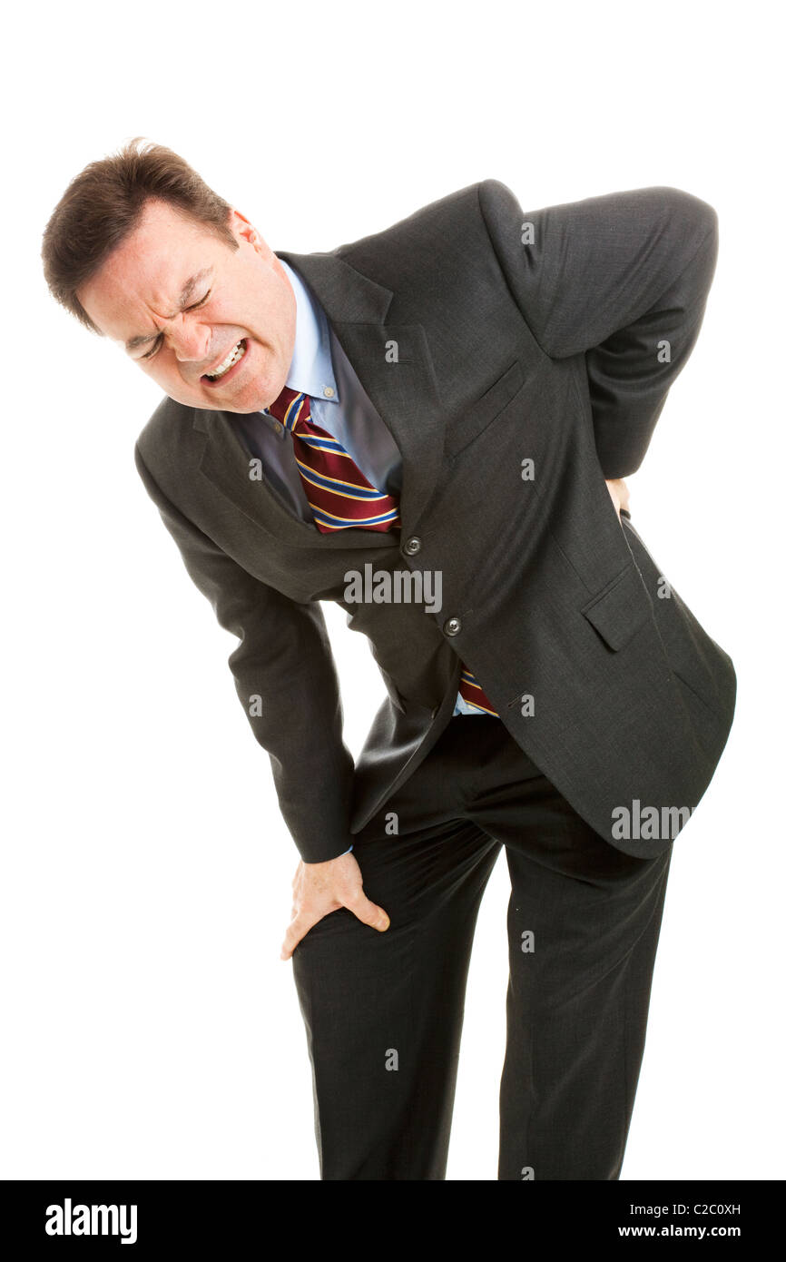 Mature businessman doubled over with back pain. Isolated on white Stock ...
