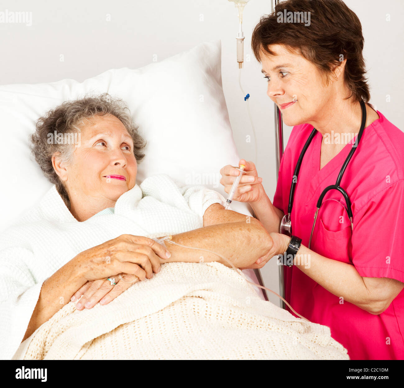 Nurse gives injection to an elderly hospital patient Stock Photo - Alamy