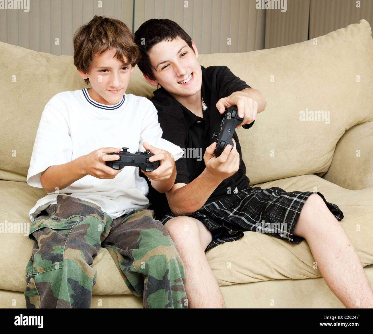 Competitive family playing video games hi-res stock photography and ...