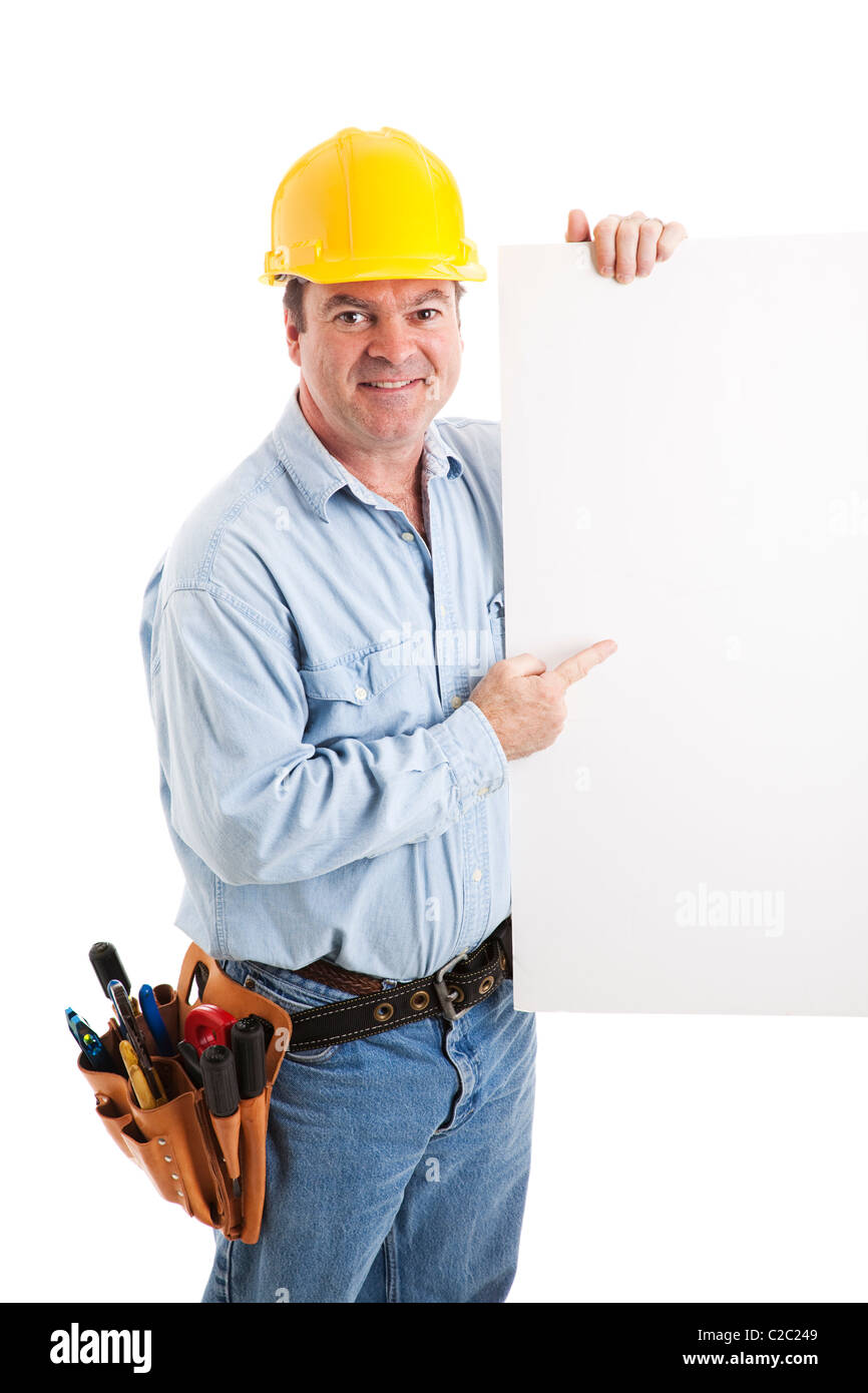 Construction worker pointing to a blank white sign. Isolated Stock Photo - Alamy