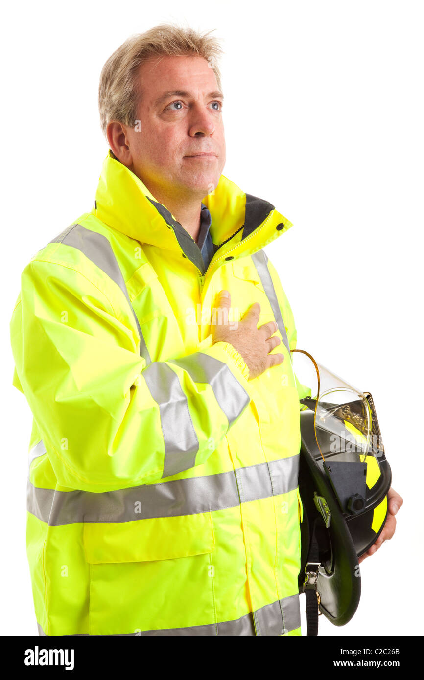 Fireman saying the Pledge of Allegiance with his hand over his heart ...