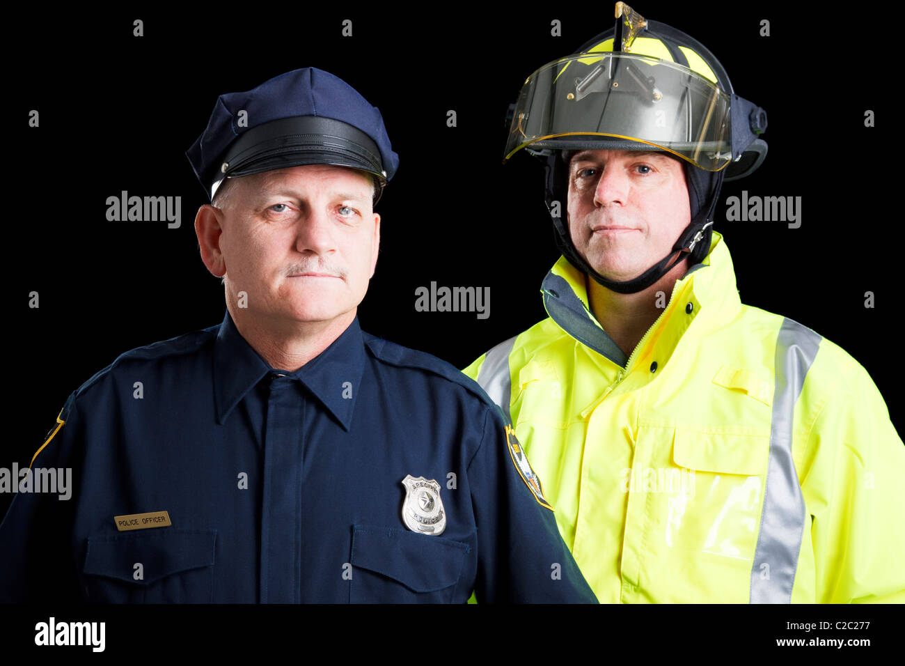 Police officer and fire fighter portrait on black Stock Photo - Alamy