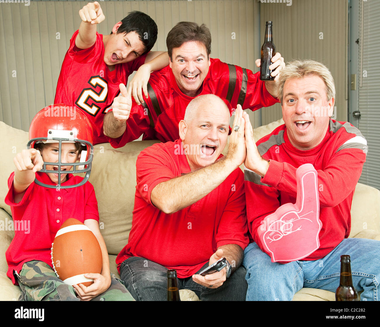American football fans get together for a super bowl party Stock Photo ...