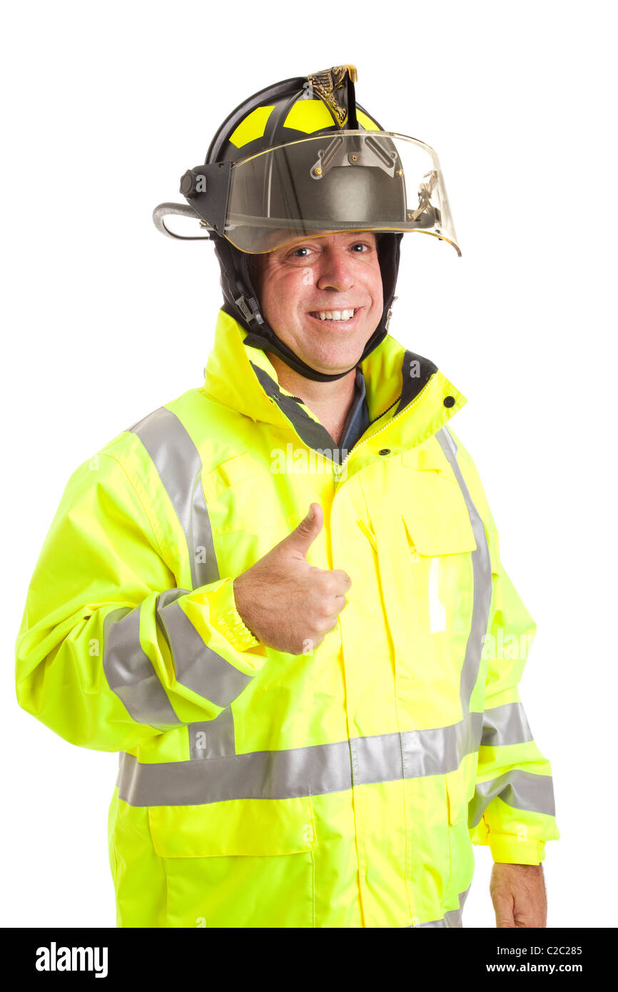 Friendly fire fighter giving the thumbs up sign. Isolated on white ...